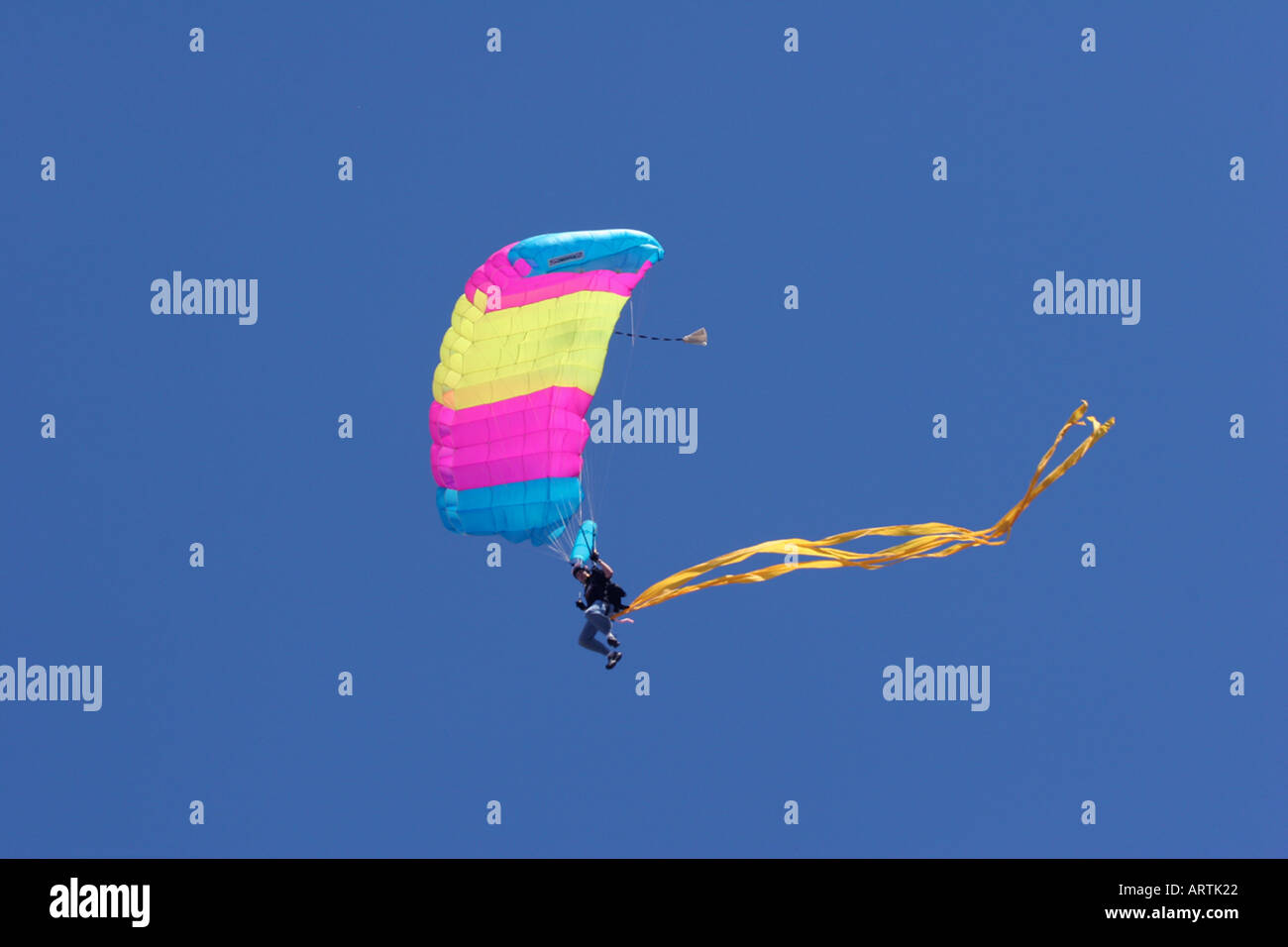 A side view of a sky diver with a colorful parachute Stock Photo - Alamy