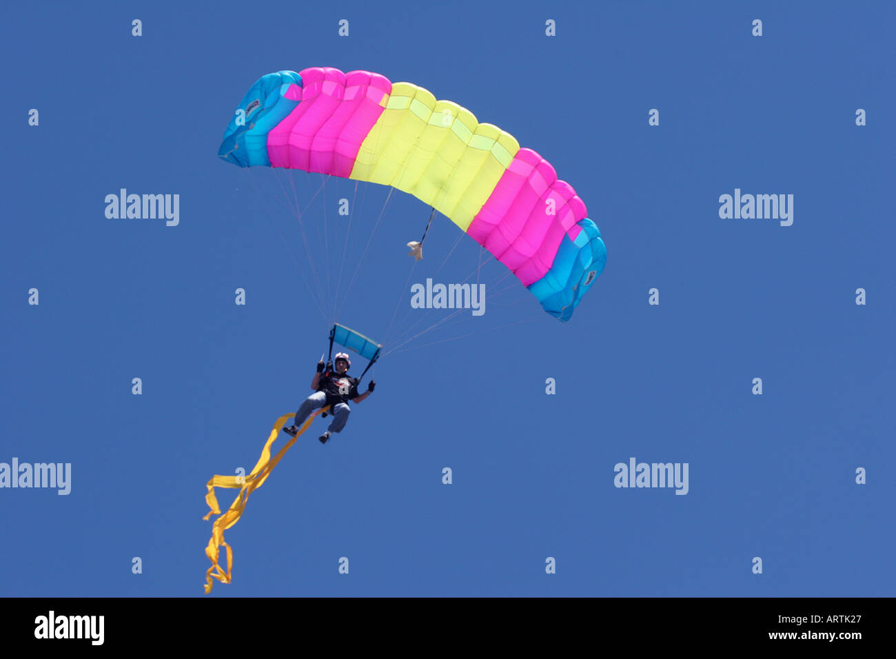 A sky diver with a colorful parachute Stock Photo - Alamy