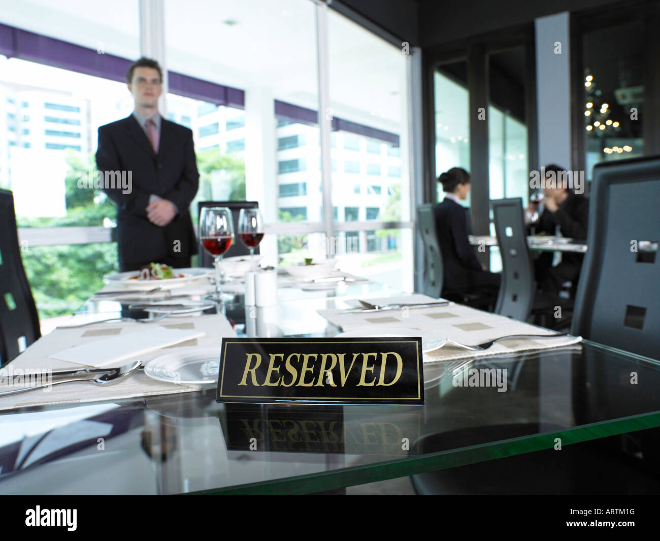 close up on reserved signage with people as background Stock Photo - Alamy