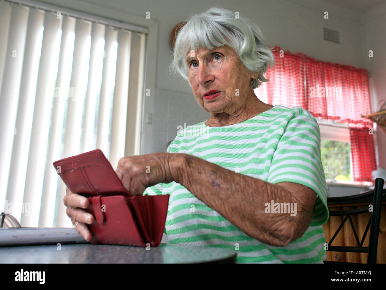 An older woman with some memory loss uses her purse Stock Photo - Alamy