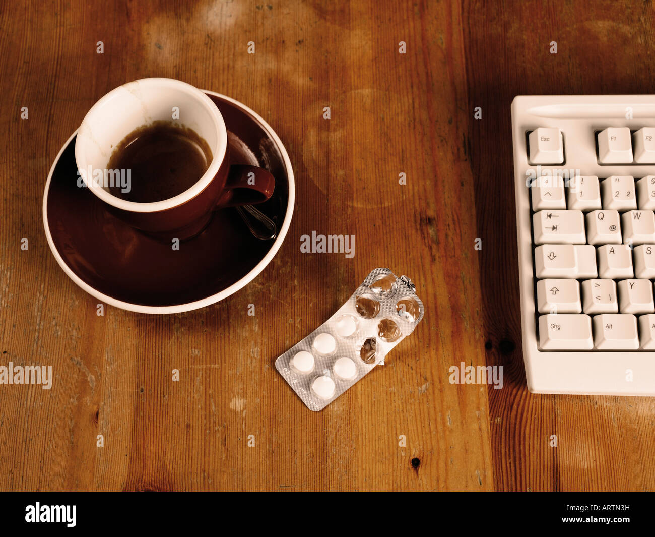 Still life with coffee tablets and computer keyboard Stock Photo - Alamy