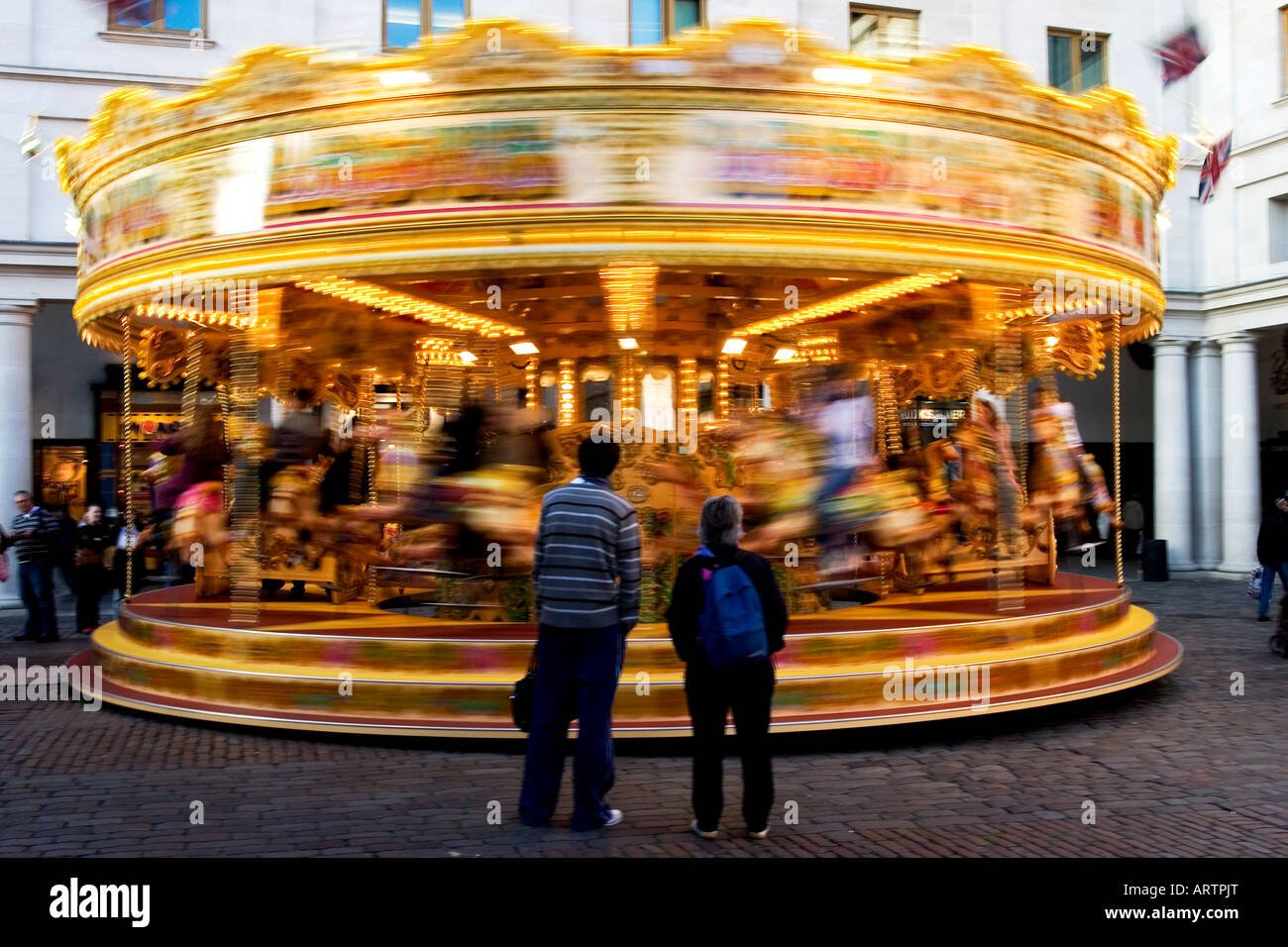 A merry go round at Covent Garden in central London Stock Photo - Alamy