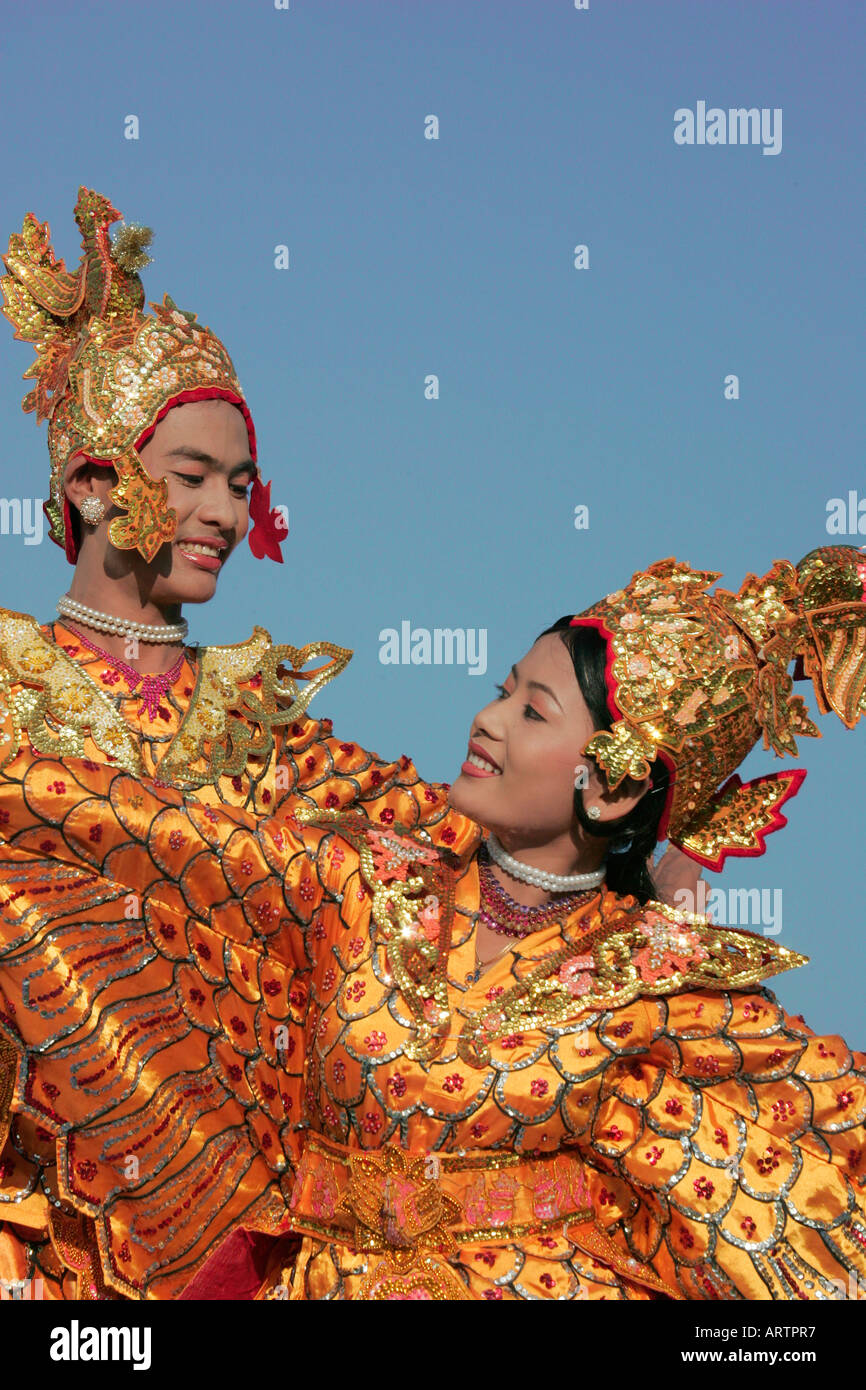 Traditional Mon dancers performing at a Pwe in Moulmein, Mon State ...