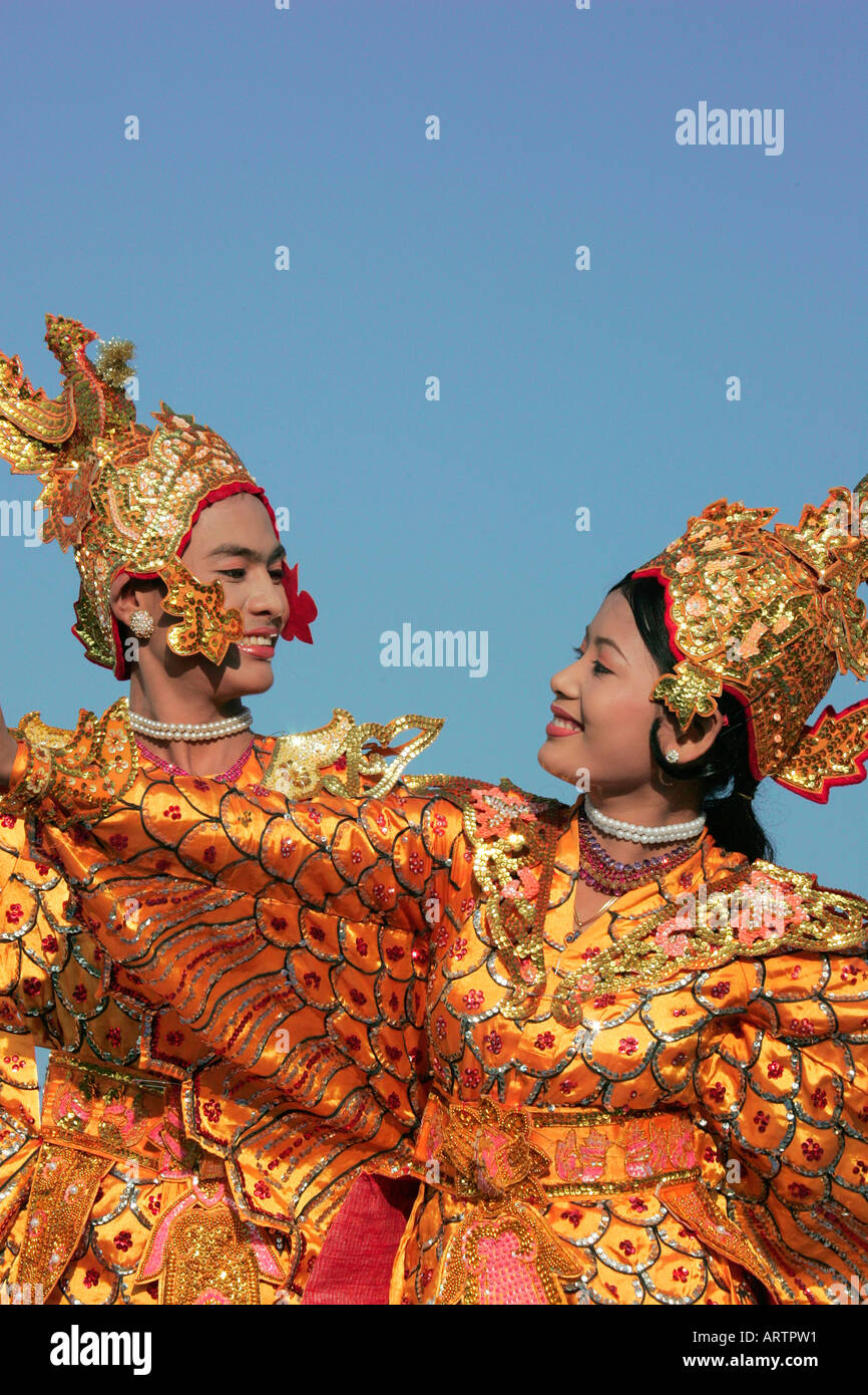 Traditional Mon dancers performing at a Pwe in Moulmein, Mon State ...