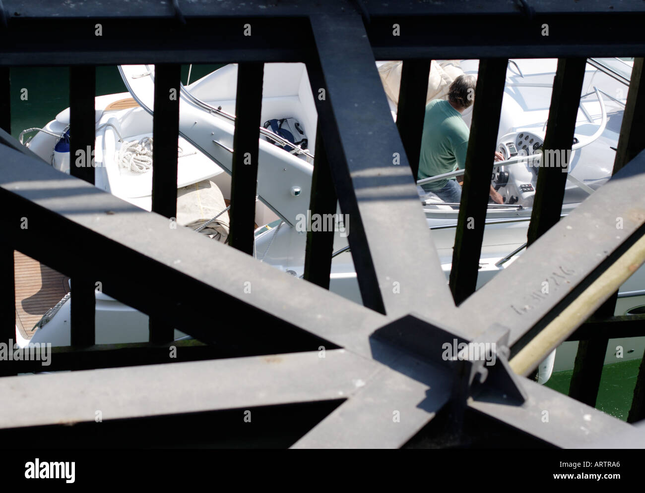 Marina lock entrance gates and passing boat Stock Photo - Alamy