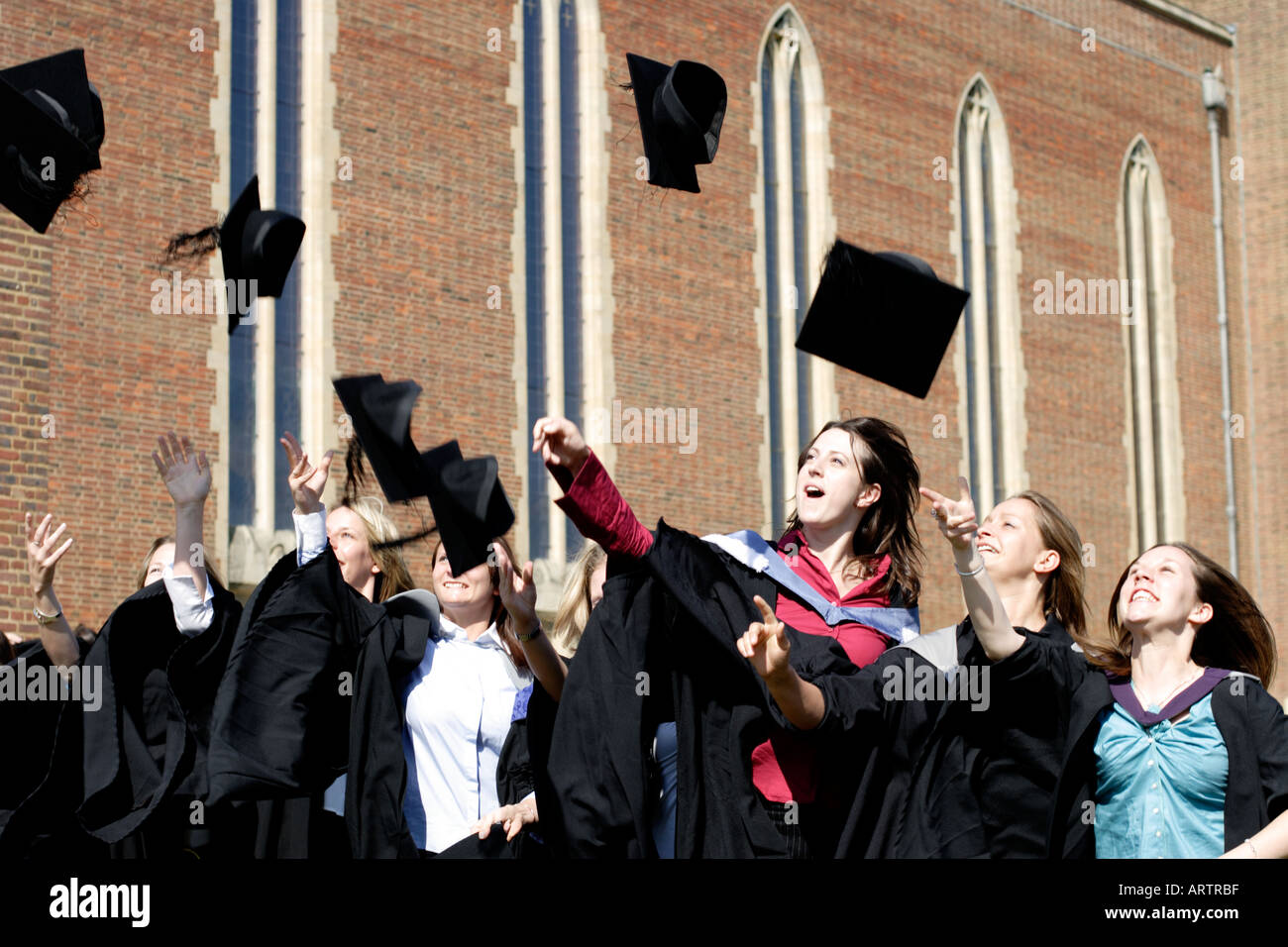 Girl graduates celebrating graduation ceremony Stock Photo - Alamy