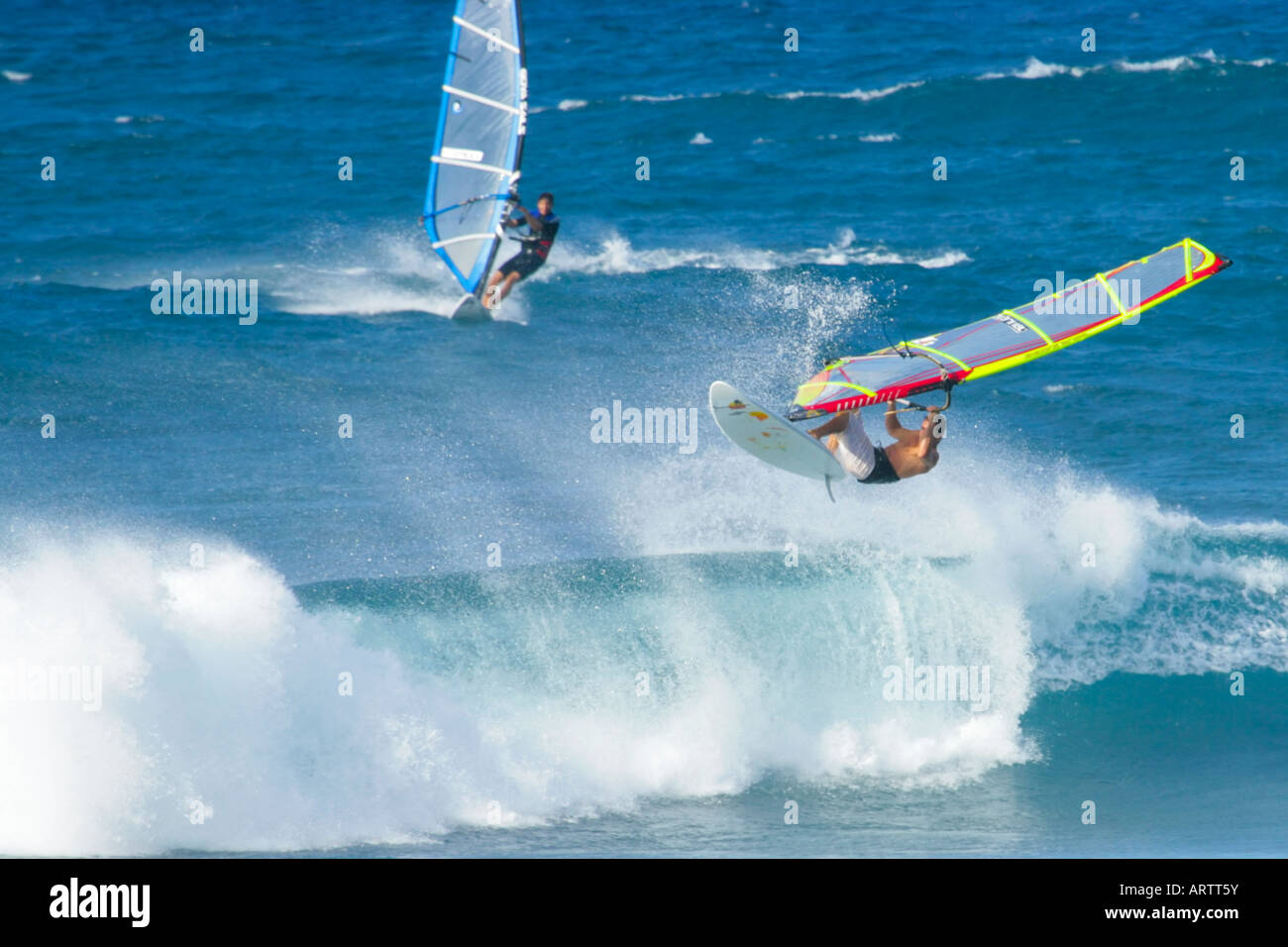 Windsurfer catches air riding surf off Hookipa Beach, Maui Stock Photo ...