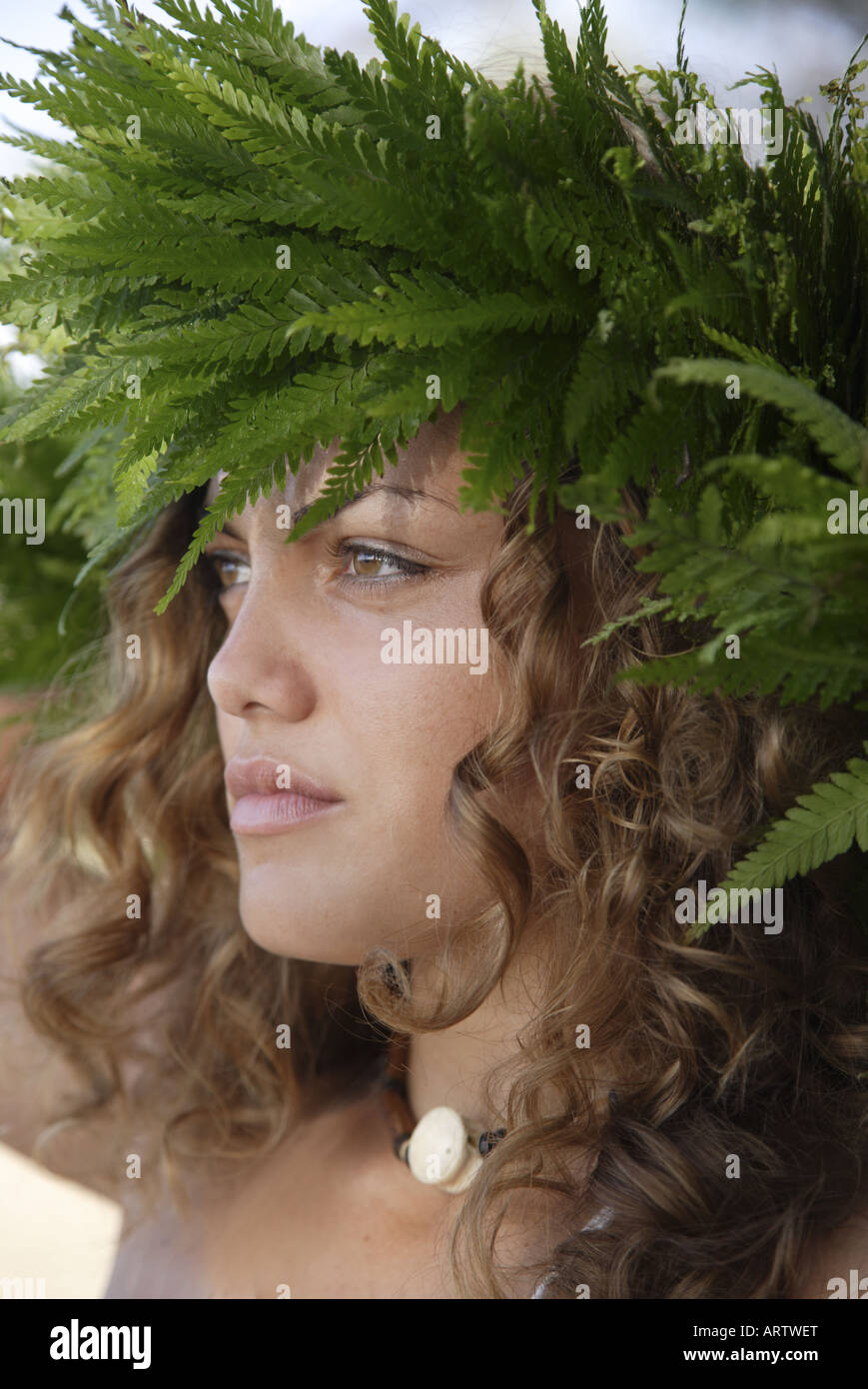 Male (kane) hula dancer deep in thought, wearing palapalai fern head ...