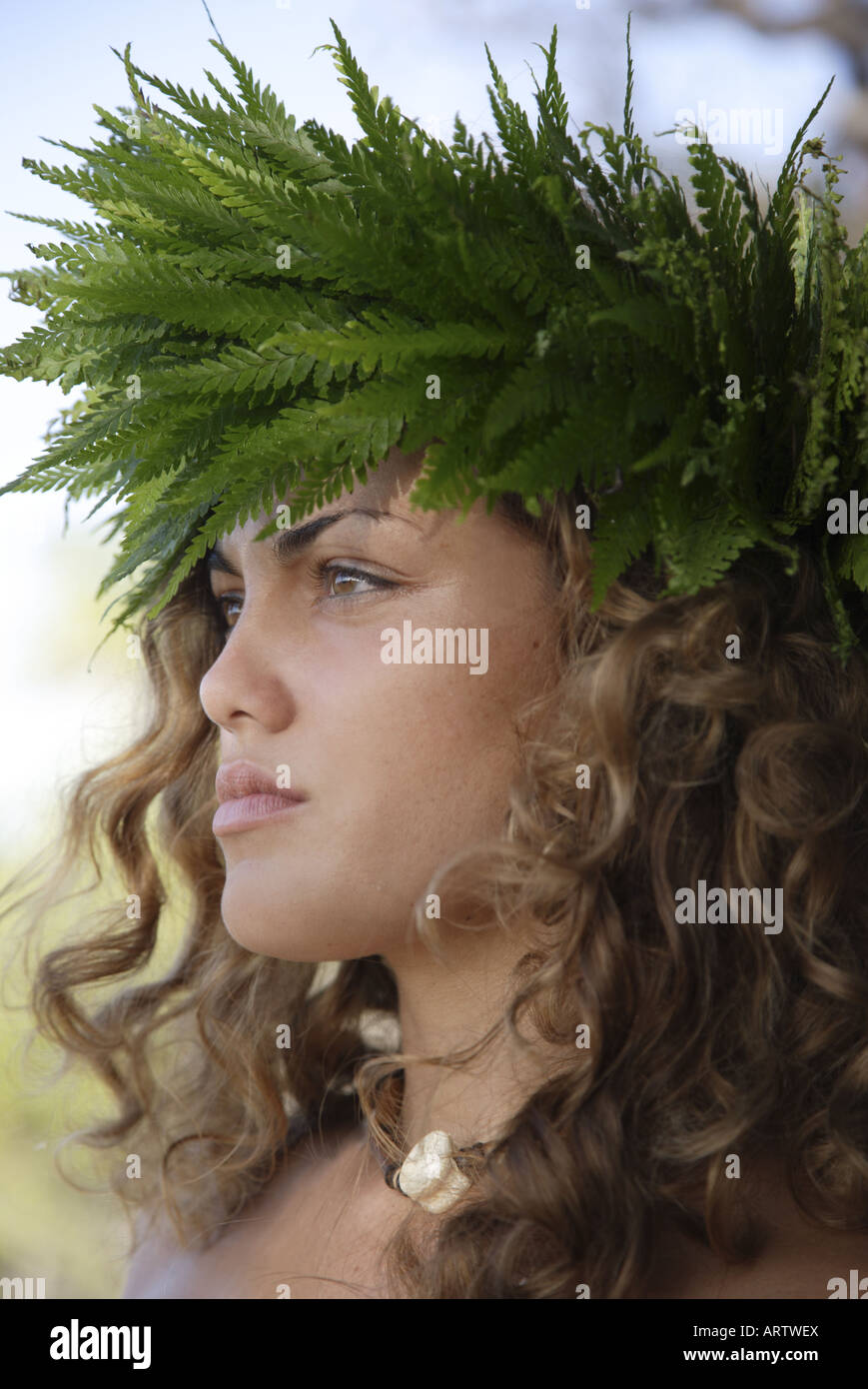 Male (kane) hula dancer deep in thought, wearing palapalai fern head ...