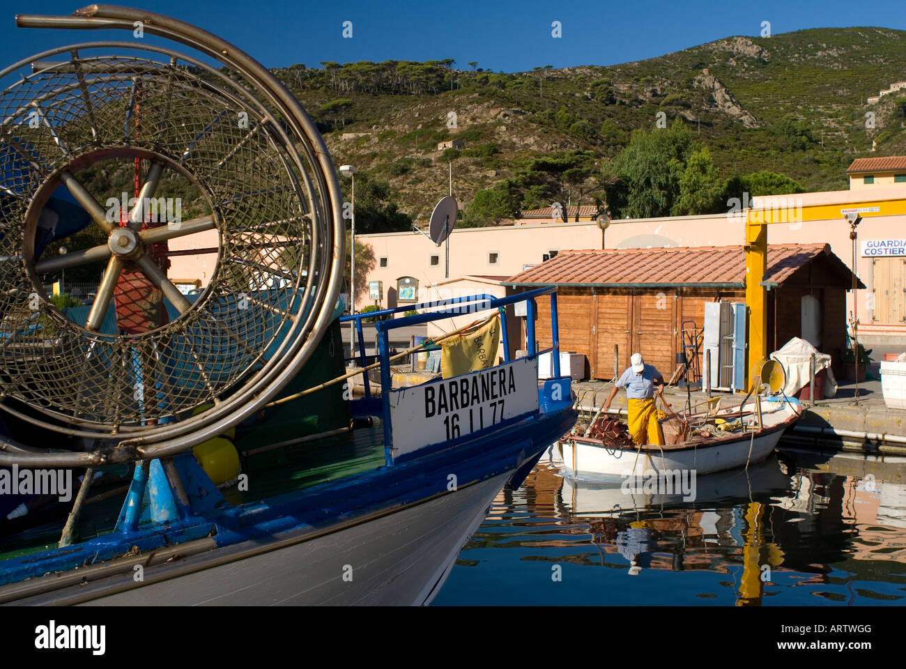 Fisherman ships in harbour of Capraia Island, Tuscany, Italy Stock ...