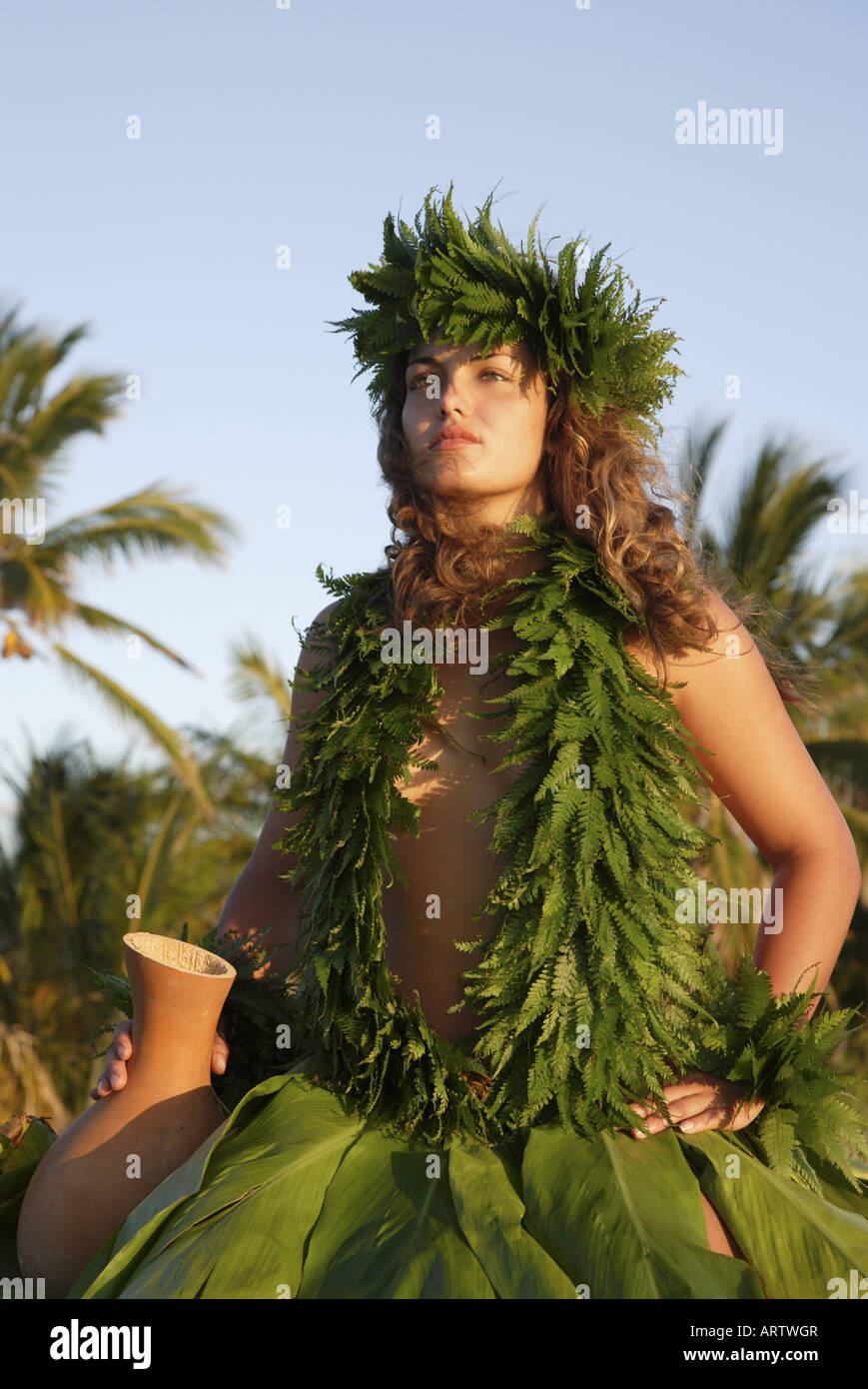 Male (kane) hula dancer deep in thought, wearing palapalai fern head ...
