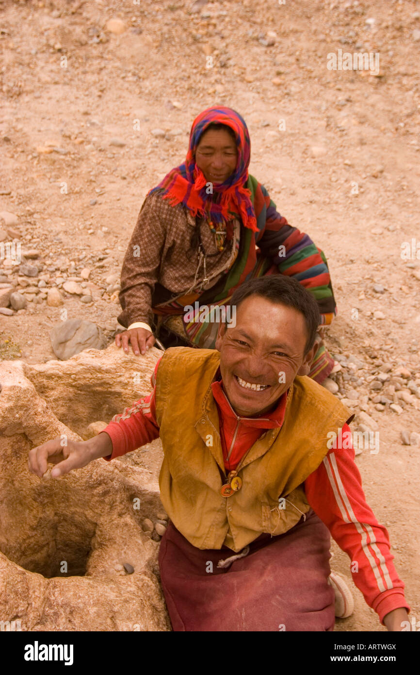 Pilgrim puls stone from hole at Tirthapuri Monastery, two white stones ...