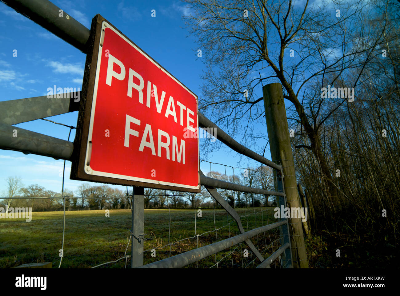 Warning sign on a farm gate in Sussex UK Stock Photo - Alamy
