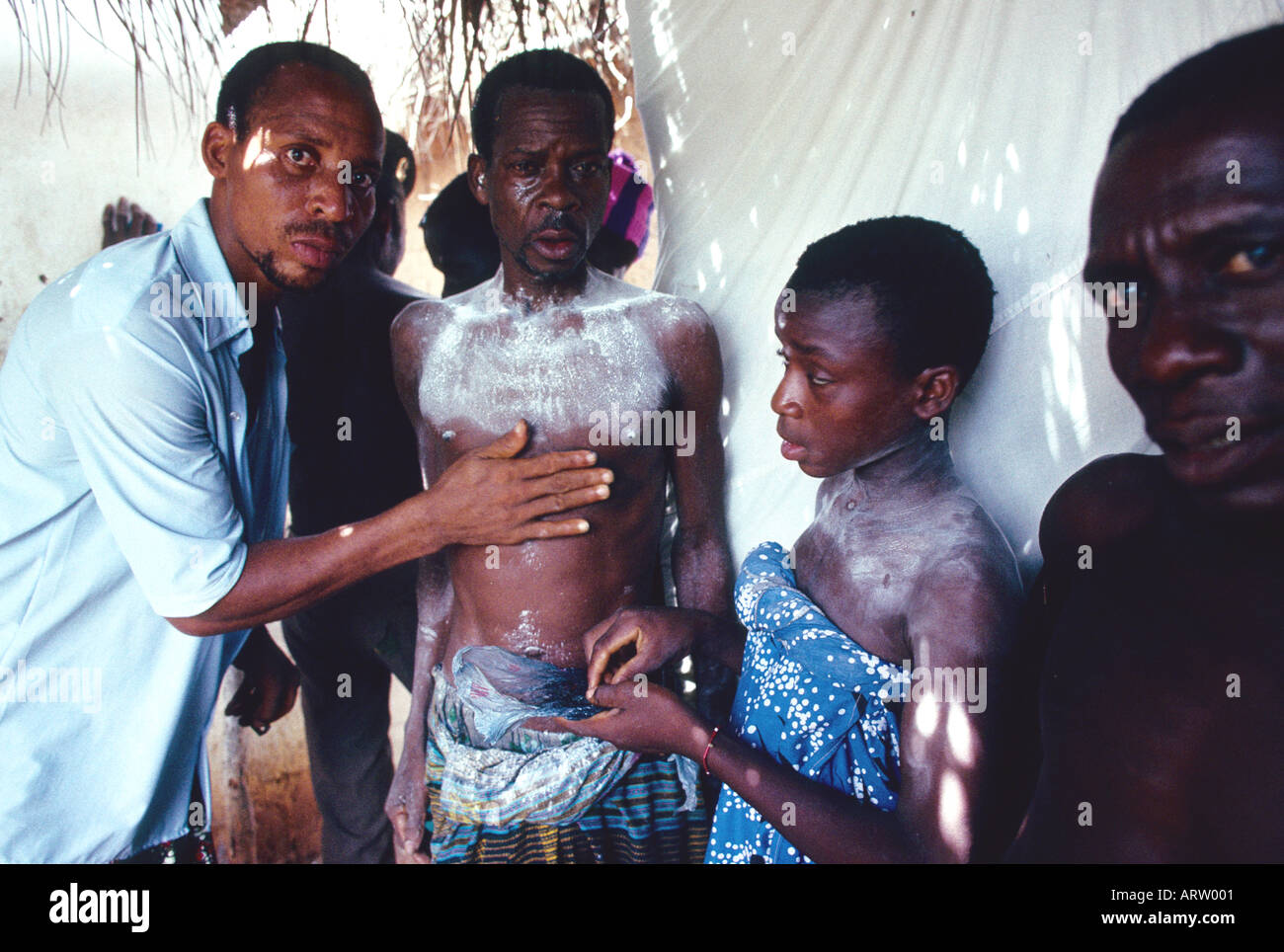 An assistant of the healer makes seven light incisions in his chest ...