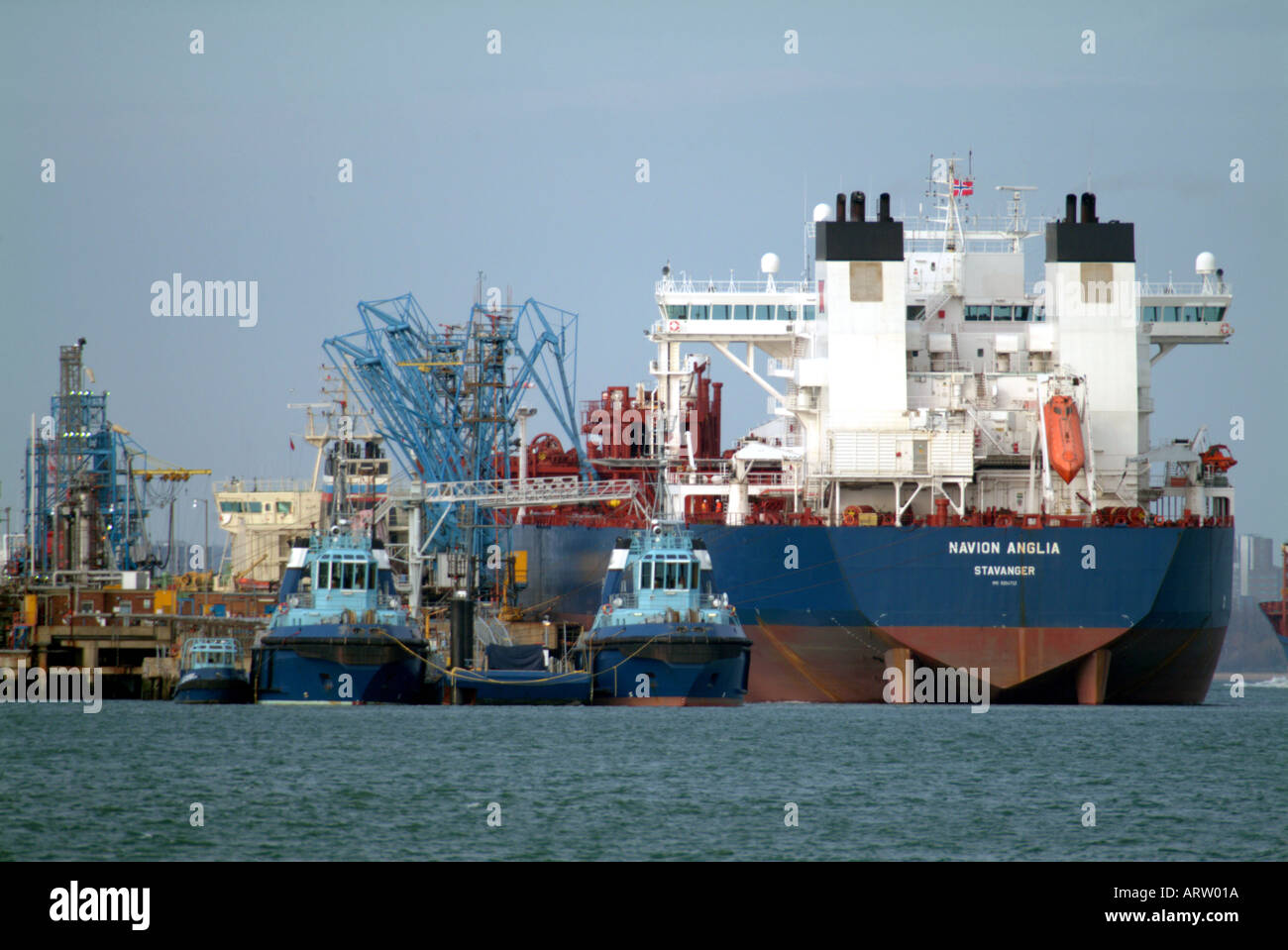 Oil tanker Navion Anglia with berthing tugs at Fawley Terminal ...