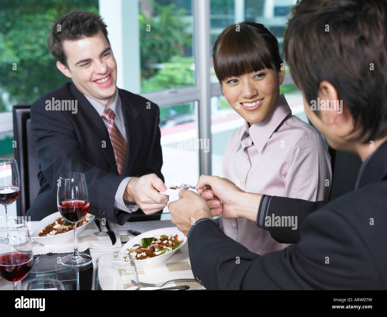 Men exchanging business cards hi-res stock photography and images - Alamy