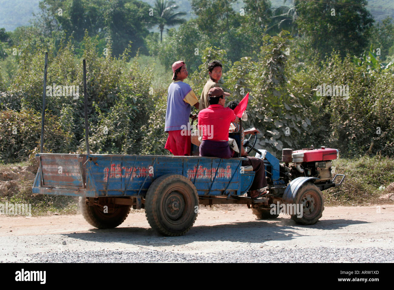 Burmese worker travelling on a "Chinese Buffalo", outside Thaton, Mon ...