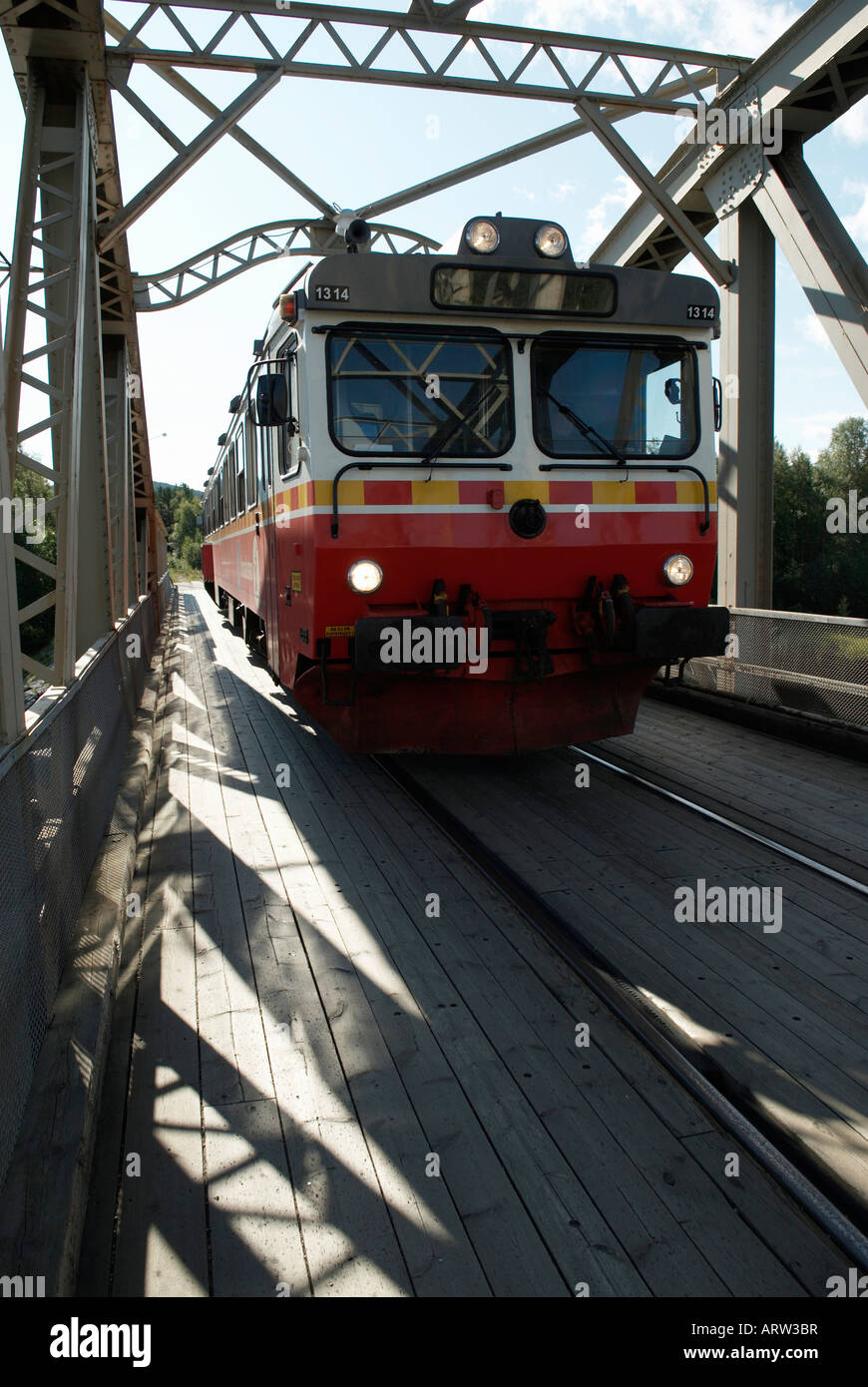 A train of the Swedish Inland Railway crossing the rail and road bridge ...
