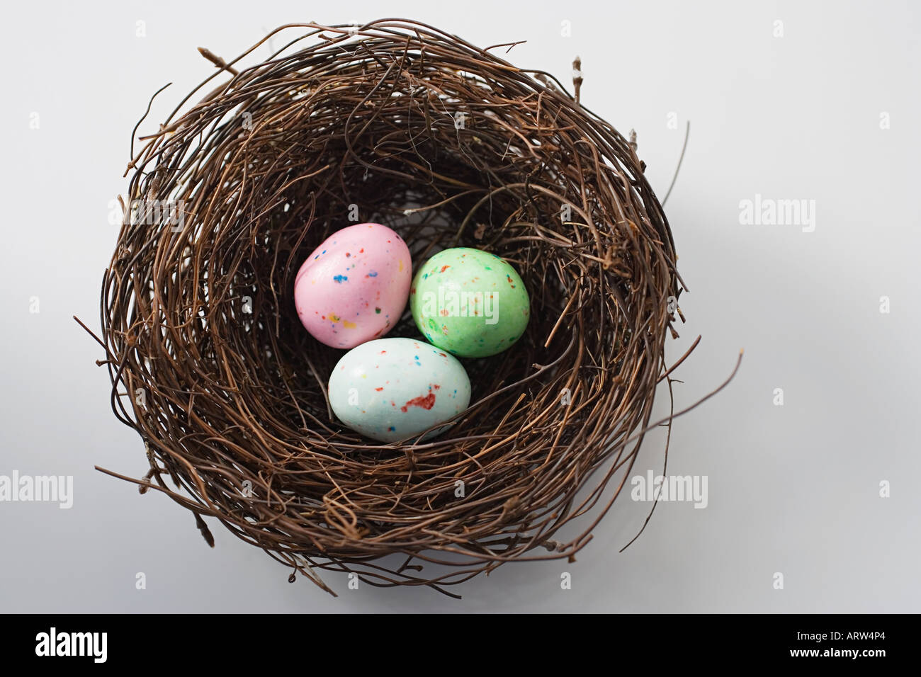 Colourful eggs in a nest Stock Photo - Alamy