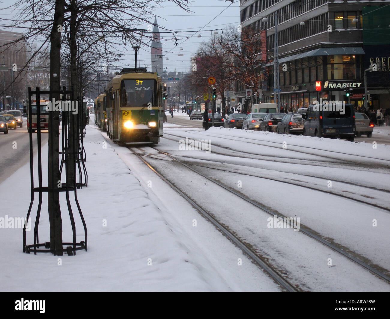 Tram in street in winter in Helsinki Finland Stock Photo - Alamy