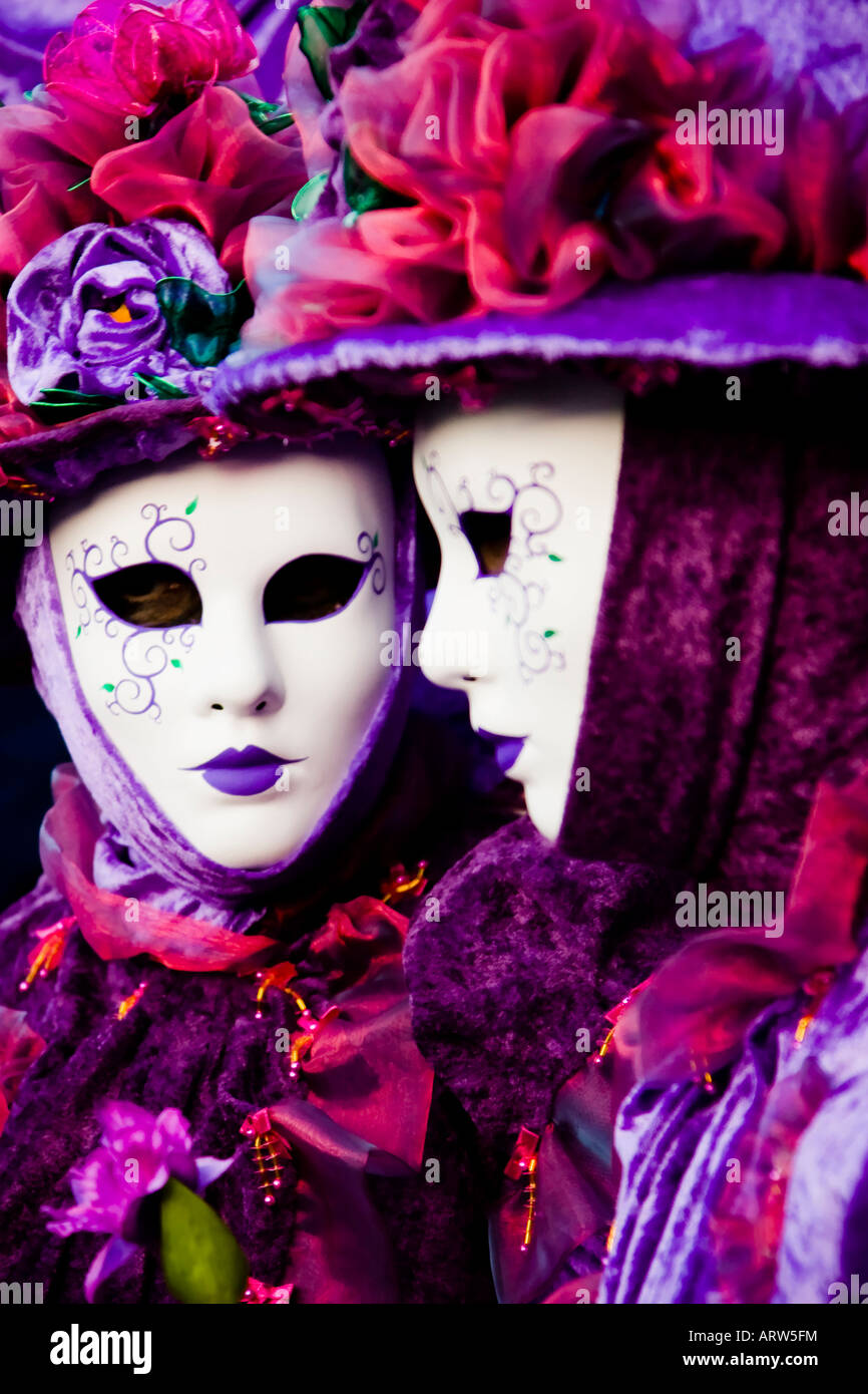 Two people dressed alike in masks and costumes attending the Venice ... Two people dressed alike in masks and costumes attending the Venice ...