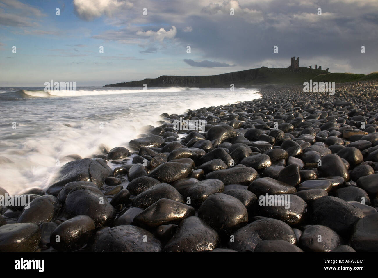 Dunstanburgh castle from the beach at Embleton, Northumberland UK Stock ...