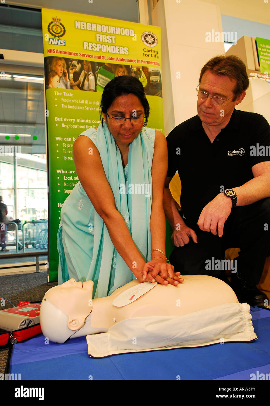 50 year old potential Asian volunteer First Responder learning ...