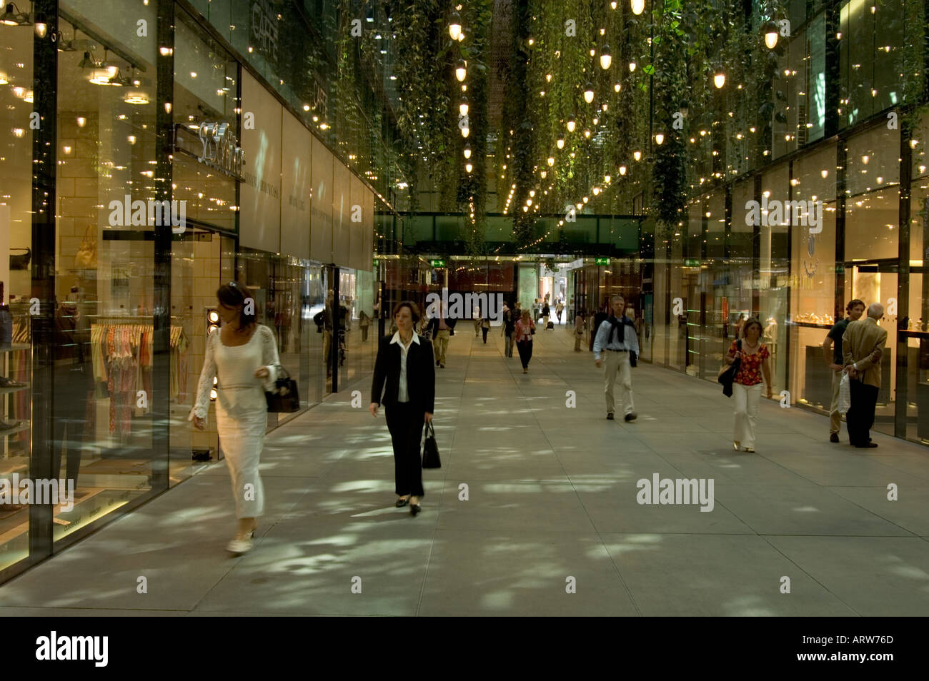 people walking in a shopping passage of the Five Courts centre of ...
