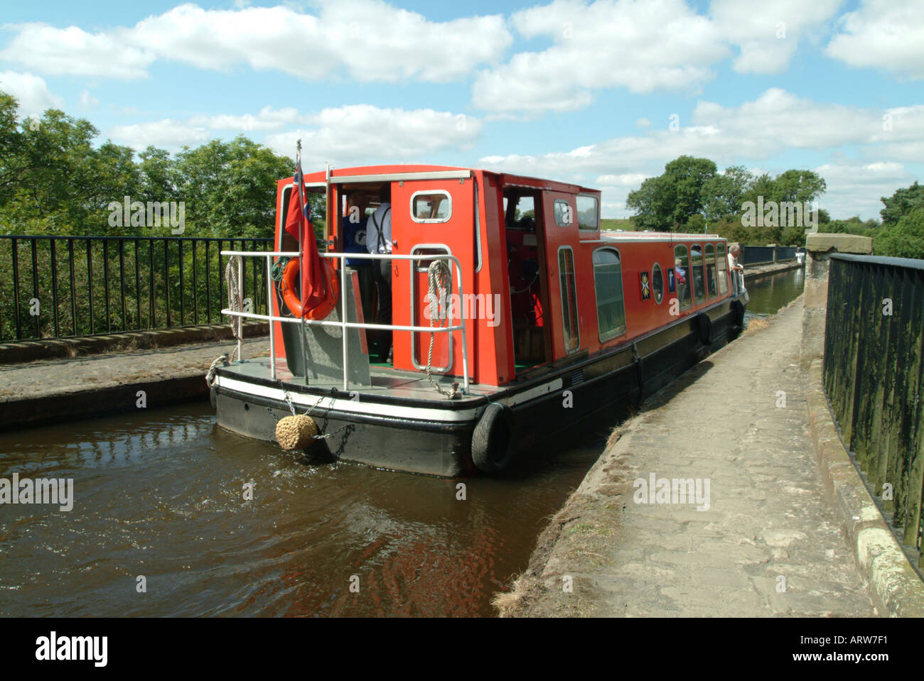 A narrow boat on the aqueduct over the river Almond in West Lothian ...