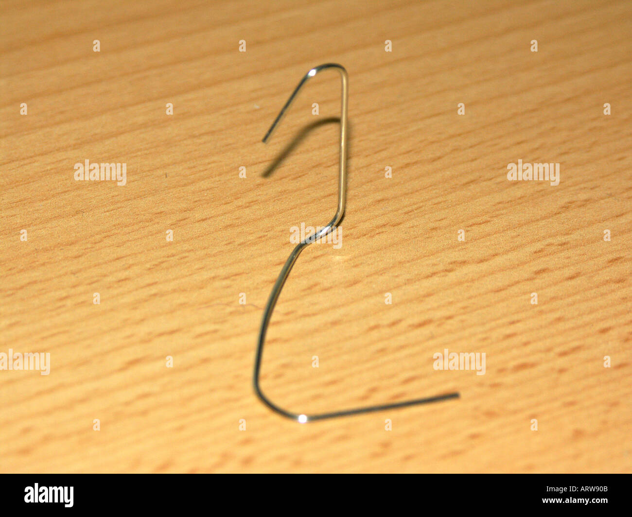 Bent Paperclip on Desk Stock Photo - Alamy