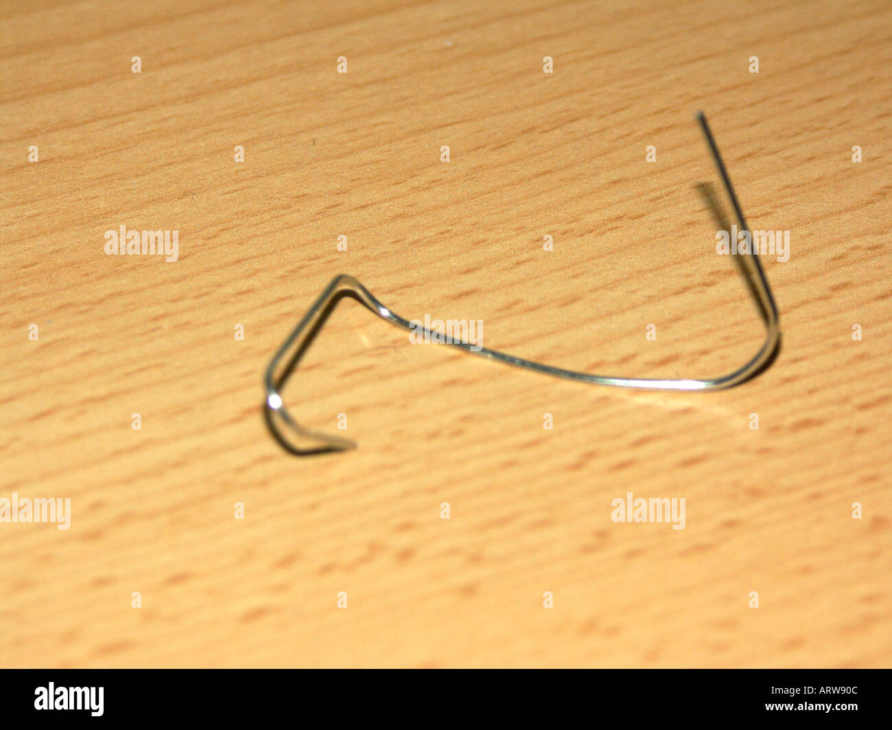 Bent Paperclip on Desk Stock Photo - Alamy