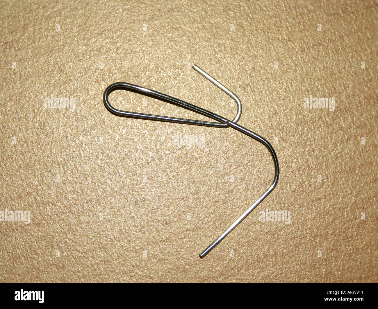 Bent Paperclip on Desk Stock Photo - Alamy