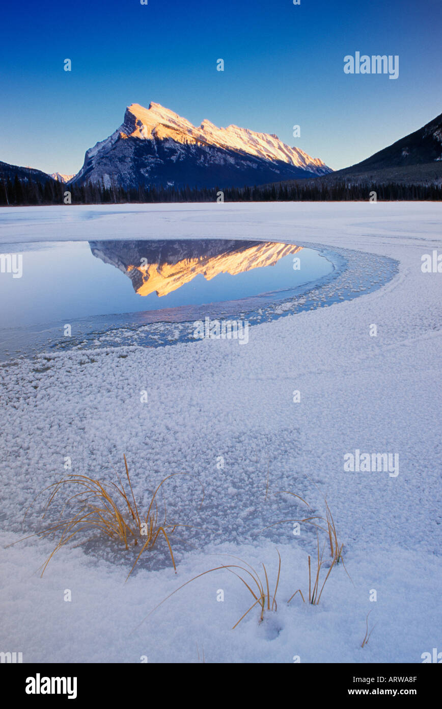 Mt Rundle and frozen Vermillion Lake in winter near Banff Stock Photo ...