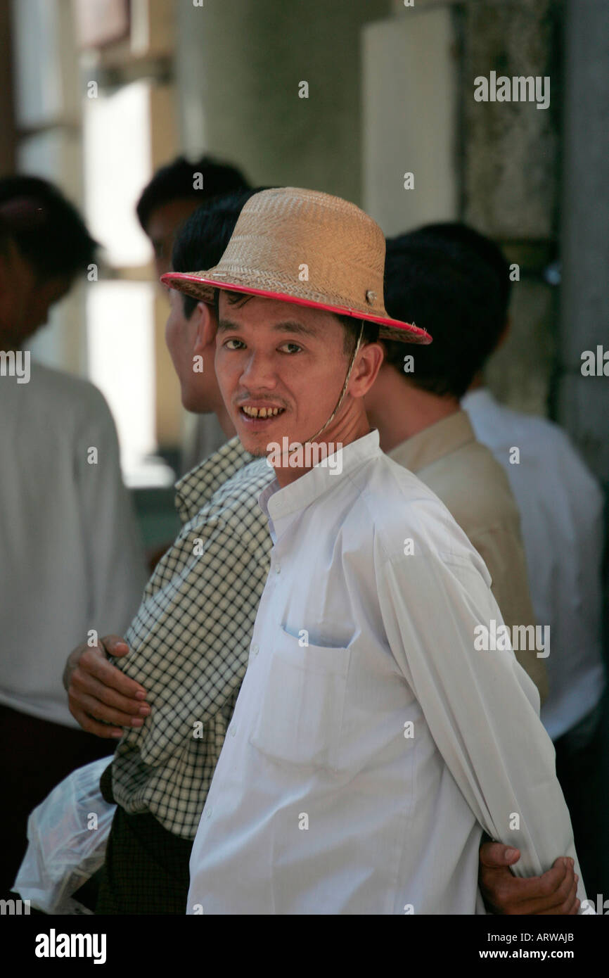 Burmese man outside the Strand Hotel, Rangoon, (Yangon), Burma ...