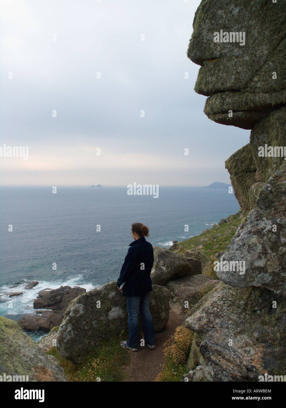 Female walker on coast path at Aire Point near Sennen Cove, Cornwall ...