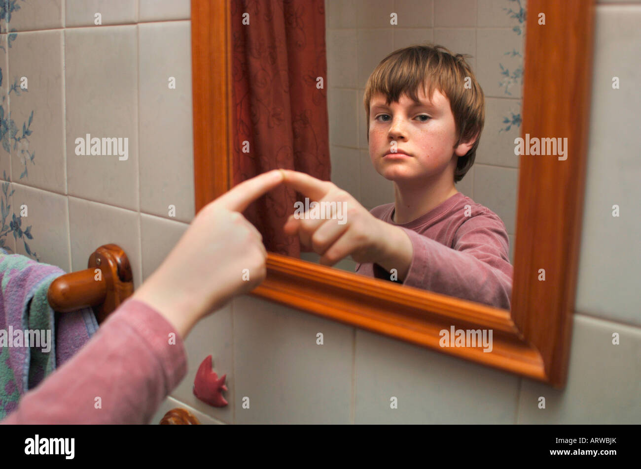 A 13yr Old Boys Reflection In A Mirror Stock Photo - Alamy
