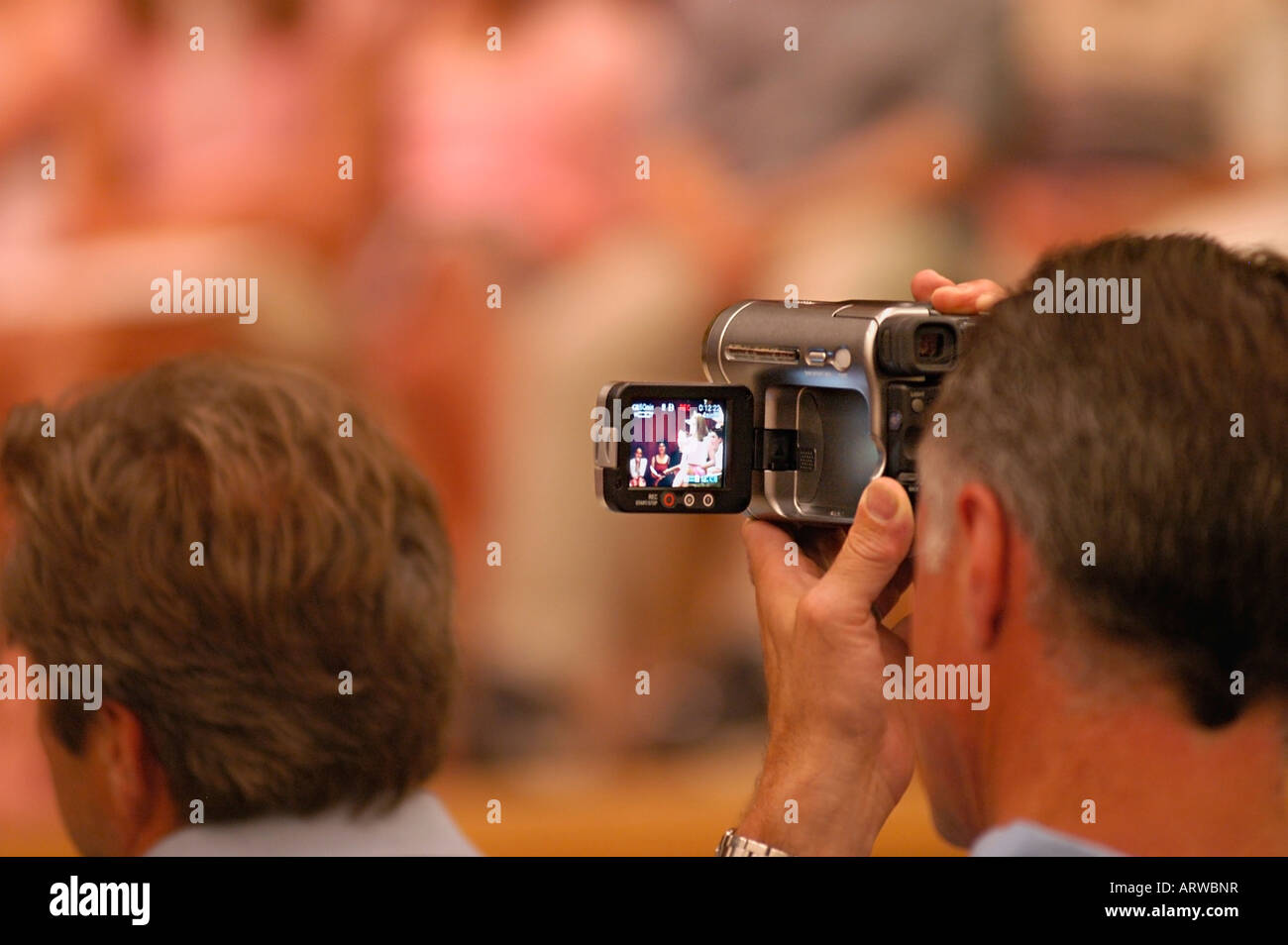 Man with video camera Stock Photo - Alamy