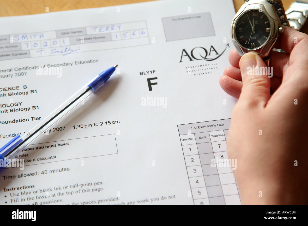 checking watch during exam Stock Photo - Alamy