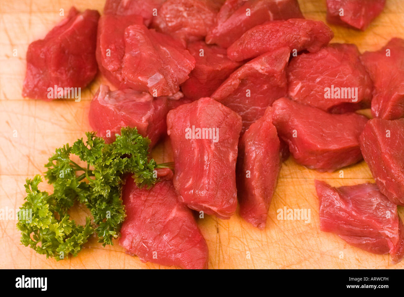 Raw beef cubes Stock Photo - Alamy
