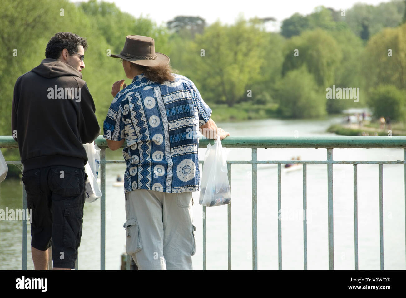 Two Men Stand Chatting Leaning on Donnington Bridge Rail Overlooking ...