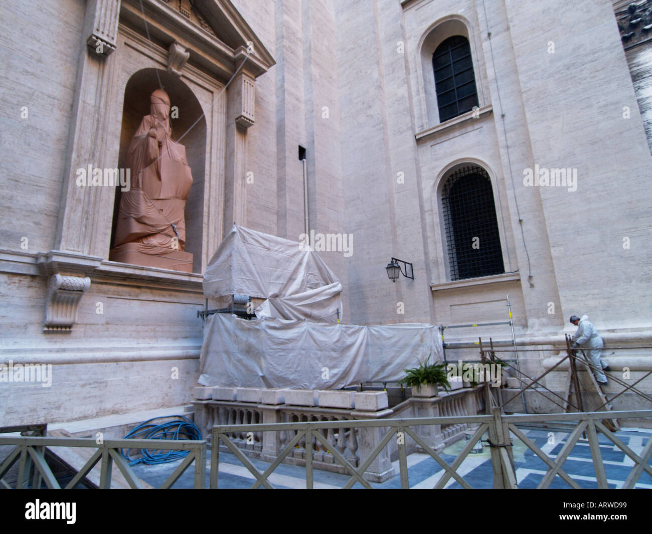 Statue of a Pope wrapped up during restoration work Vatican city Rome ...