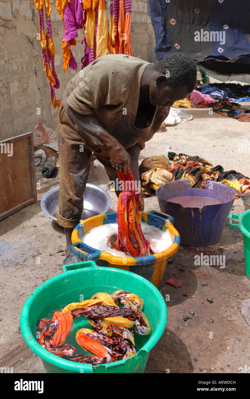 Worker dyeing traditional veils Nouakchott Mauritania Stock Photo - Alamy