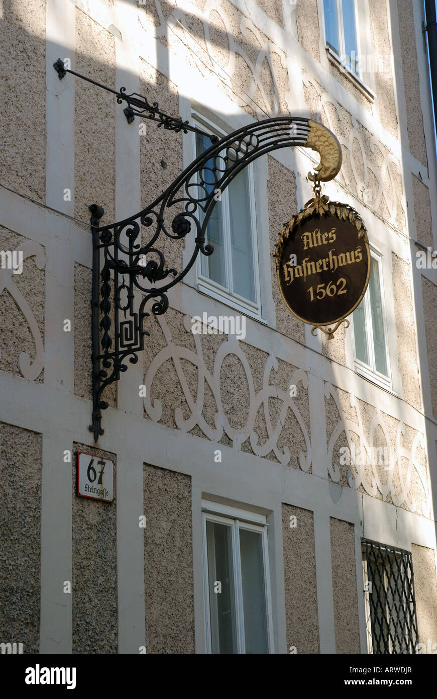 Shop Sign Hanging in Street Salzburg Austria Stock Photo - Alamy