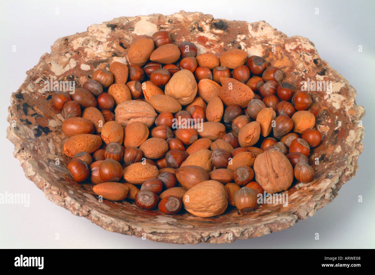 bowl of whole mixed nuts in shell studio white background Stock Photo ...