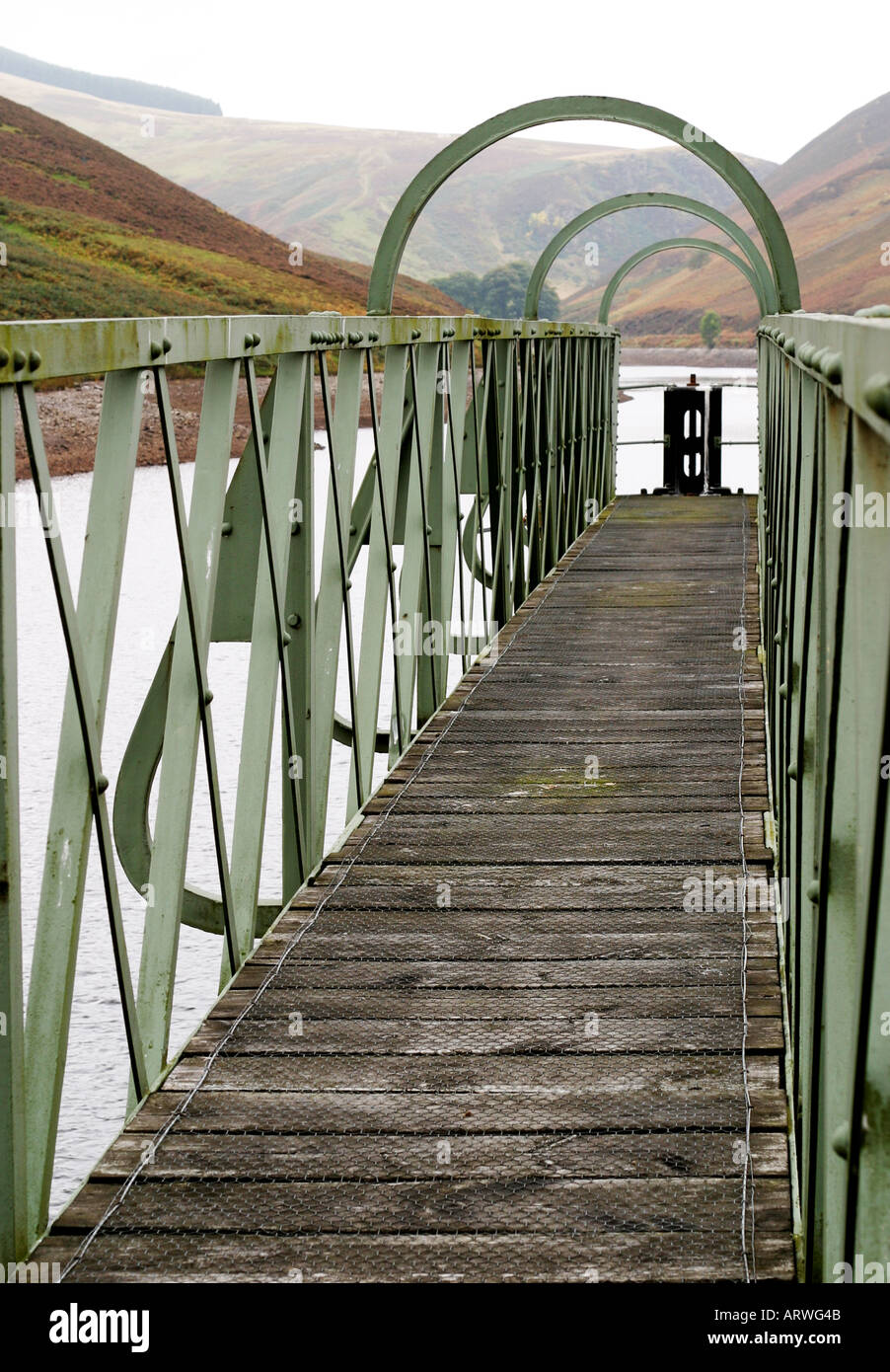 view down an old green cast iron Reservoir access bridge in the ...