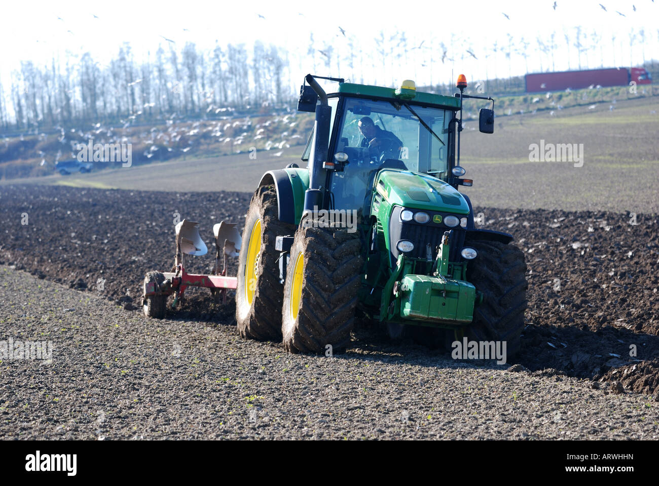 Tractor ploughing field ready for crops in Kent Stock Photo - Alamy