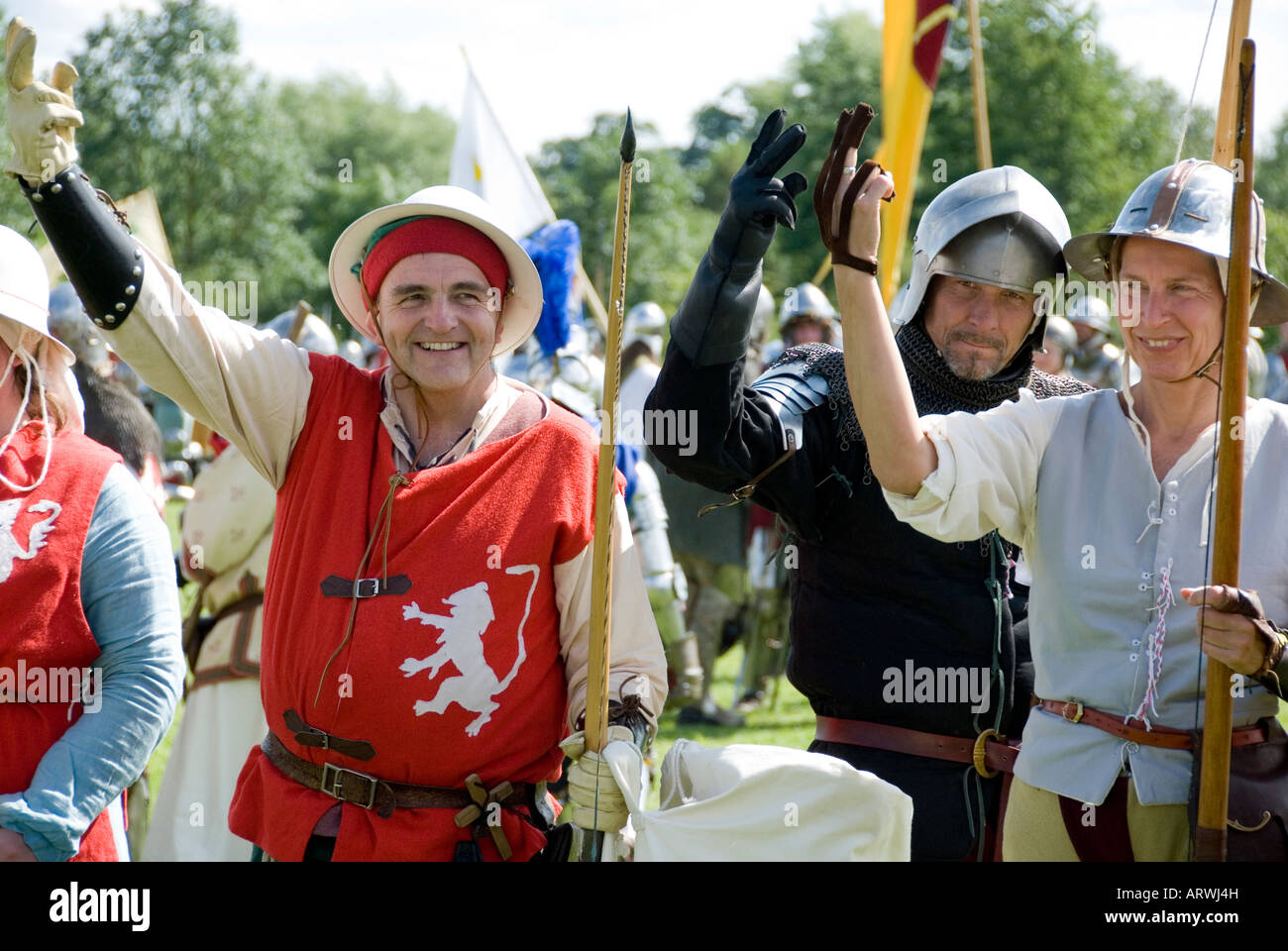 Three Smiling Archers Perform Two Finger Salute I can Still Shoot You ...