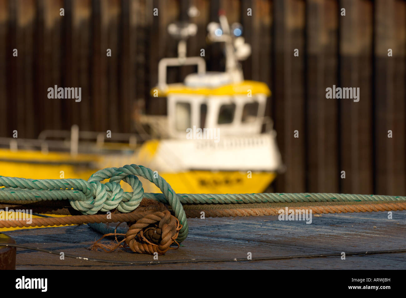 Fishing boat tied to pier hi-res stock photography and images - Alamy