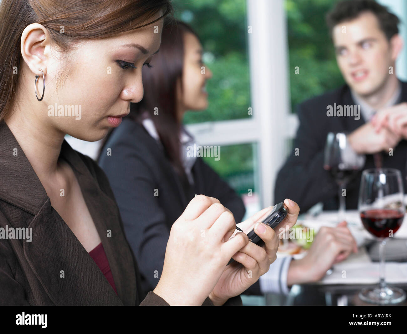 Businesswoman Using PDA Stock Photo - Alamy