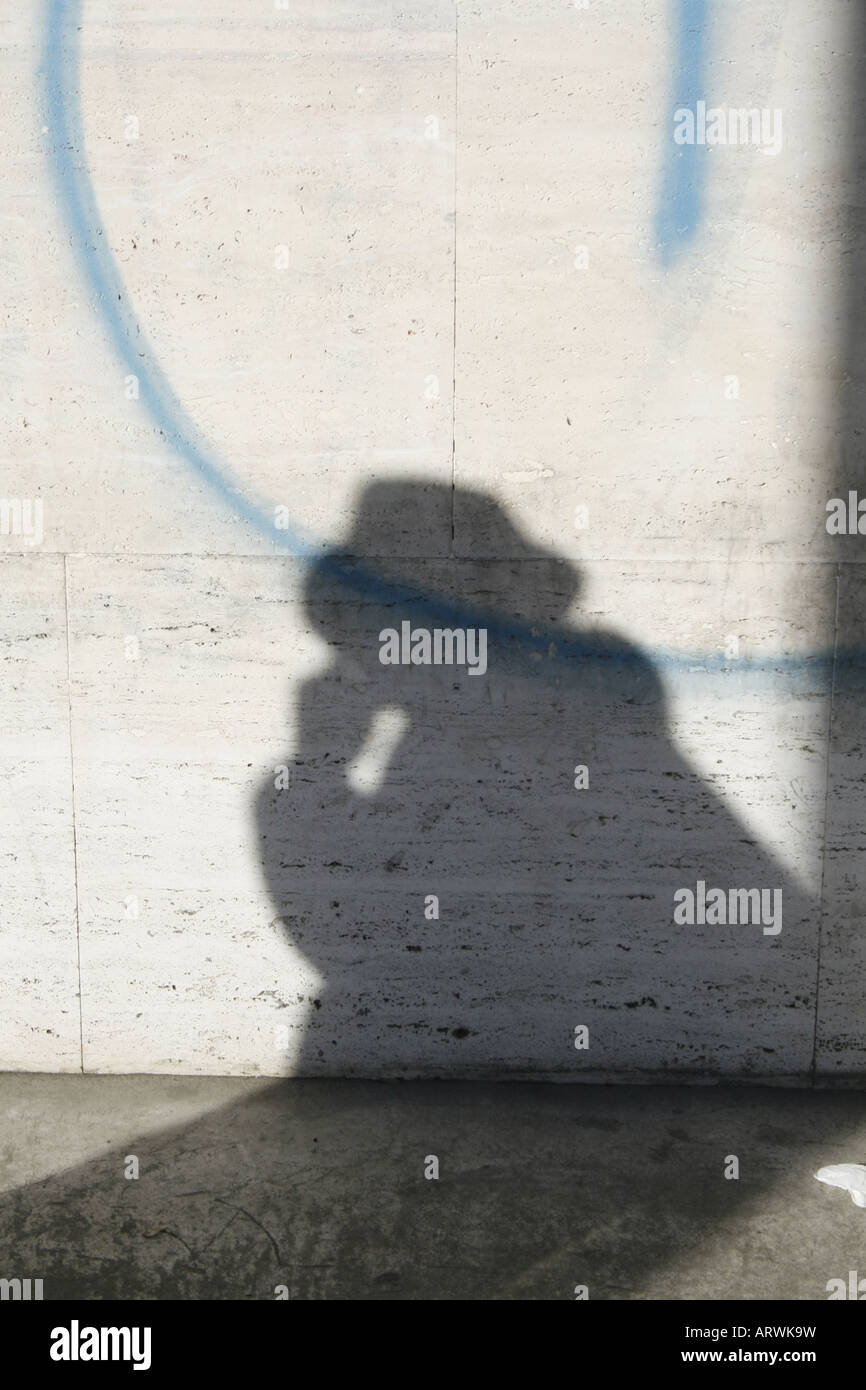 shadow of man talking on mobile phone Stock Photo - Alamy